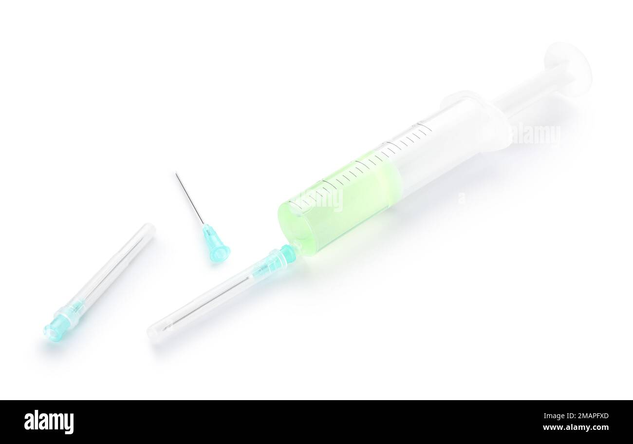 Medical syringe with remedy and needles on white background Stock Photo ...