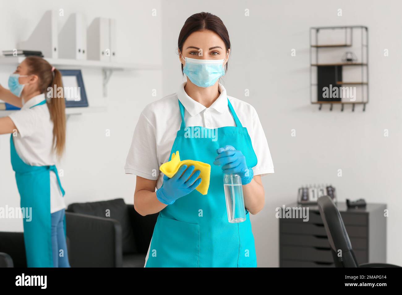 Female janitor medical mask hi-res stock photography and images - Alamy