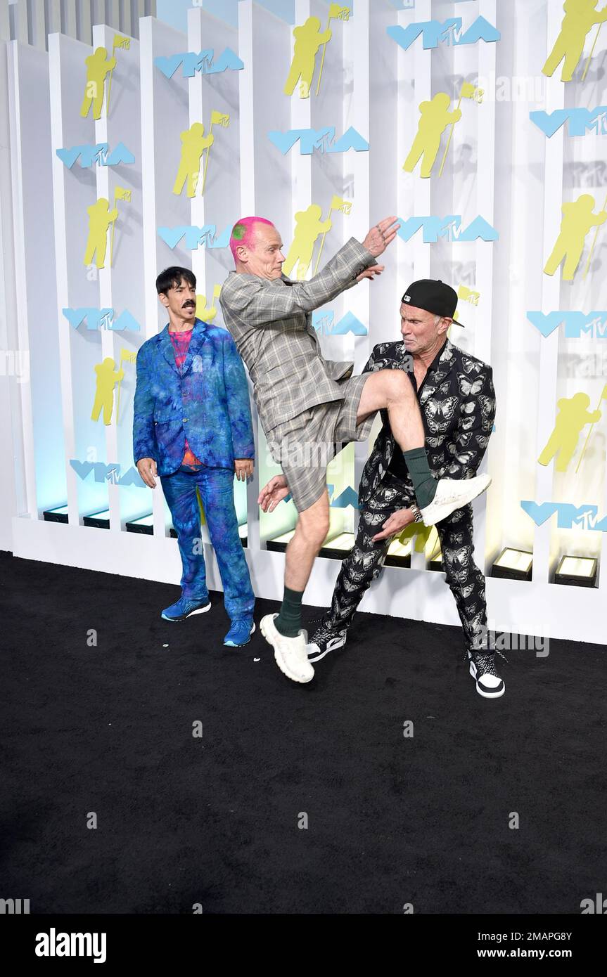 Red Hot Chili Peppers, from left, Anthony Kiedis, Flea and Chad Smith ...