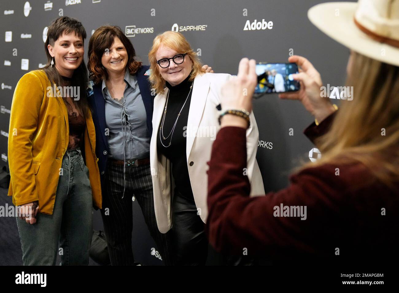 Alexandria Bombach, left, Amy Ray and Emily Saliers attend the premiere ...