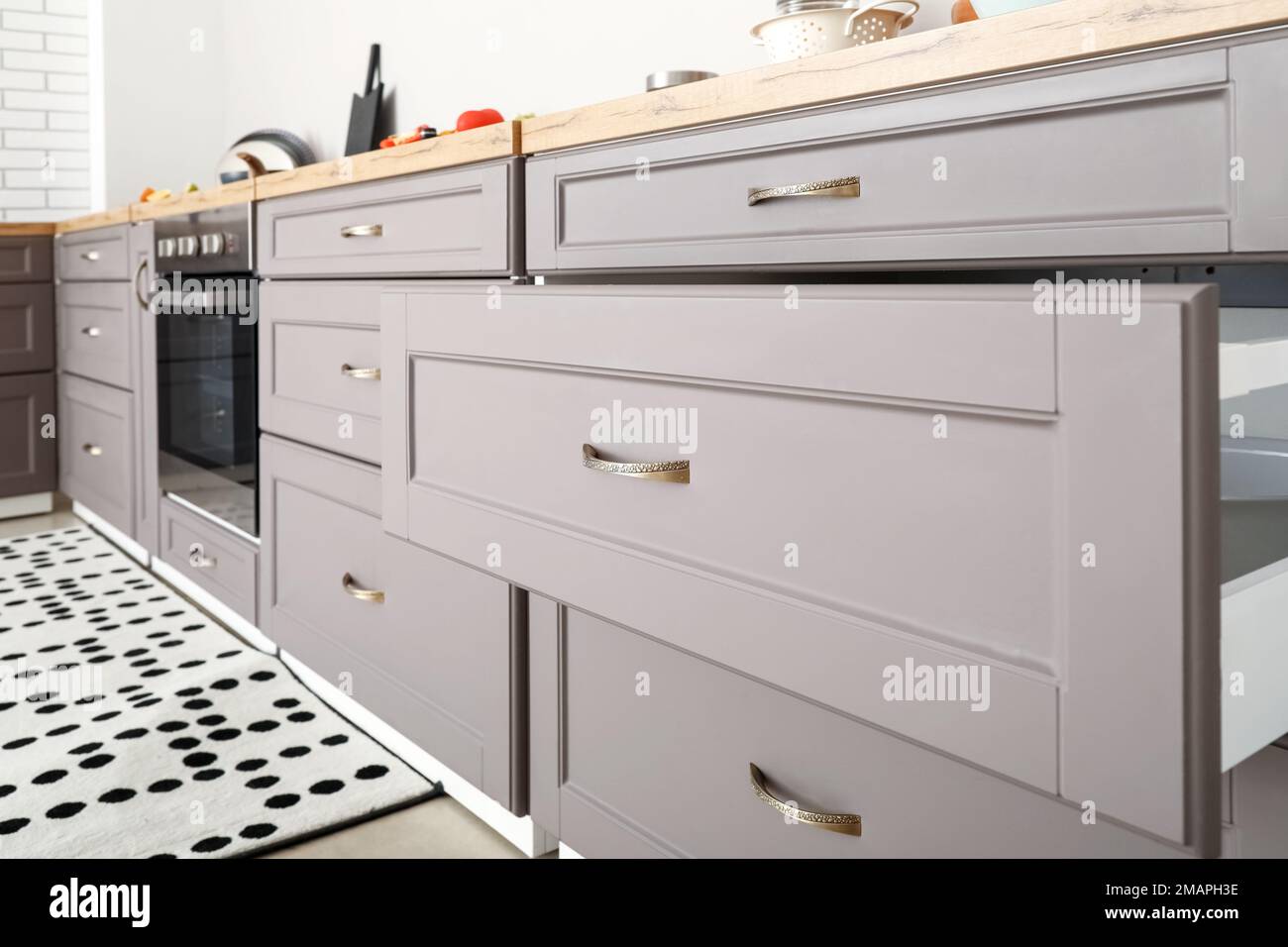Grey counter with open drawer in modern kitchen, closeup Stock Photo ...