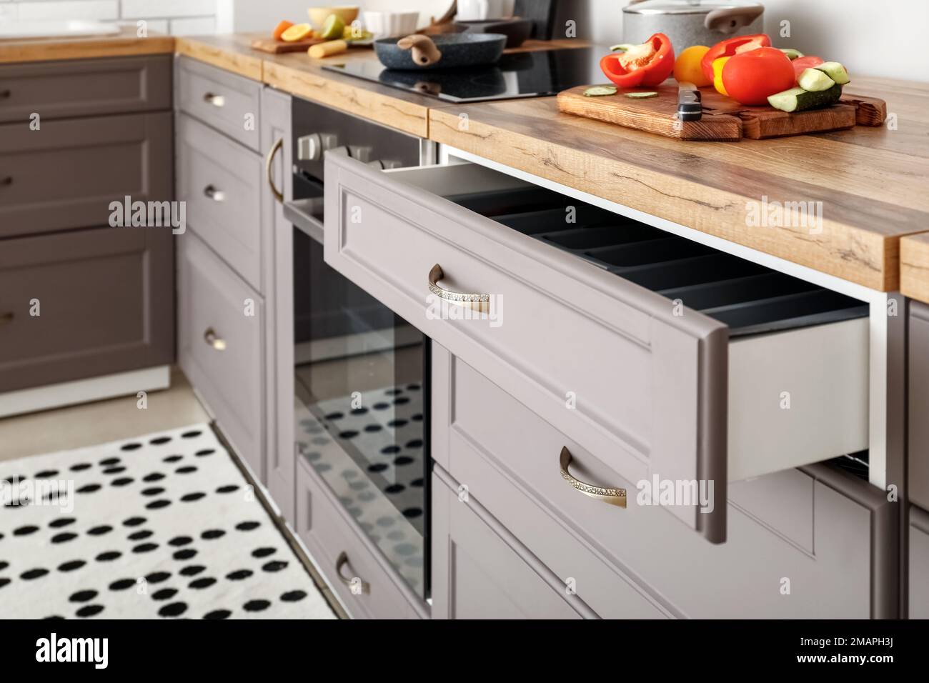 Grey counter with open drawer in modern kitchen, closeup Stock Photo ...