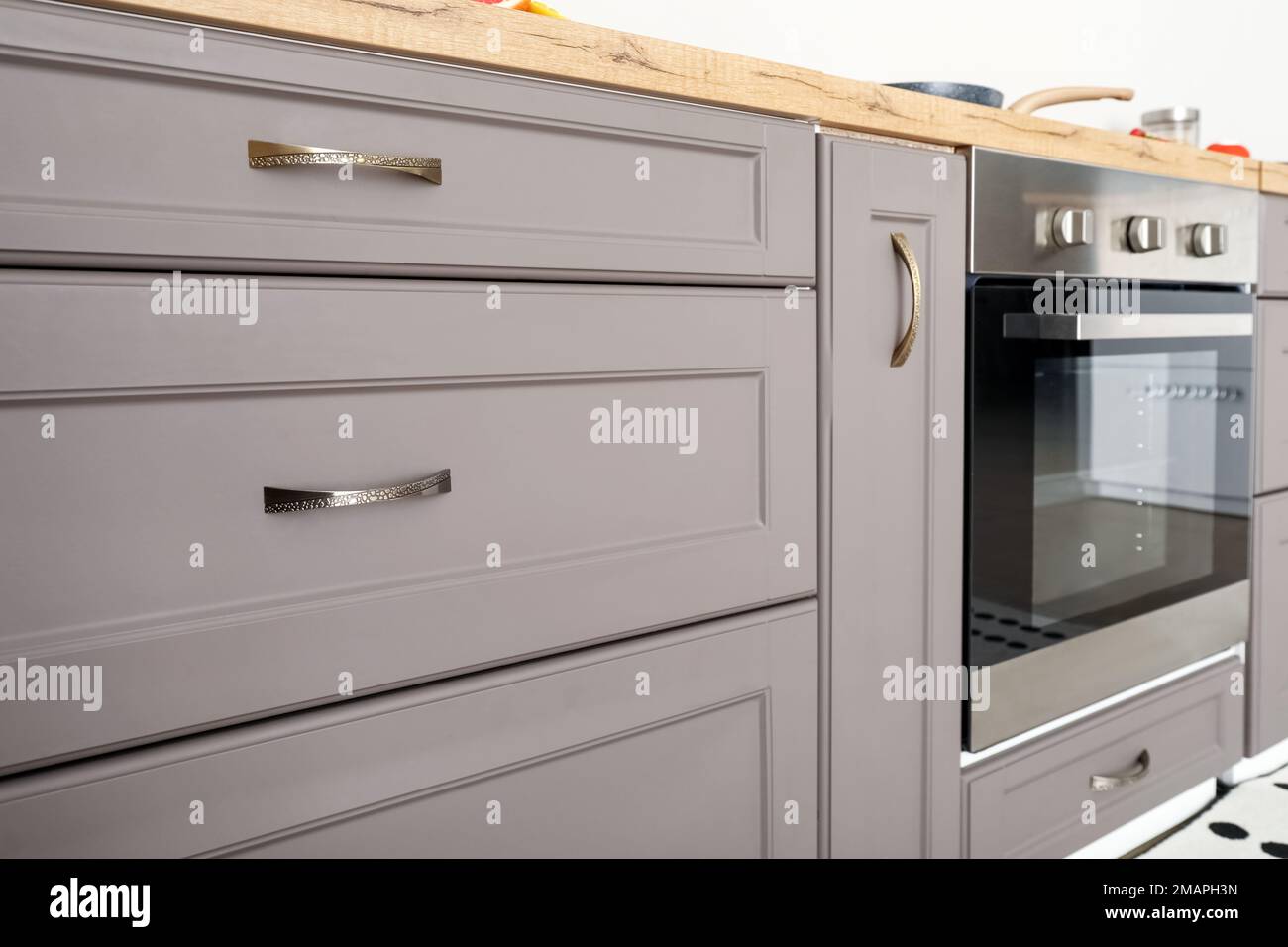Grey counter with drawers in modern kitchen, closeup Stock Photo - Alamy