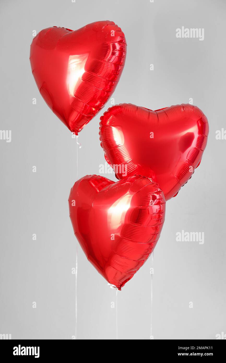 Heart shaped balloons for Valentine's Day on light background Stock ...