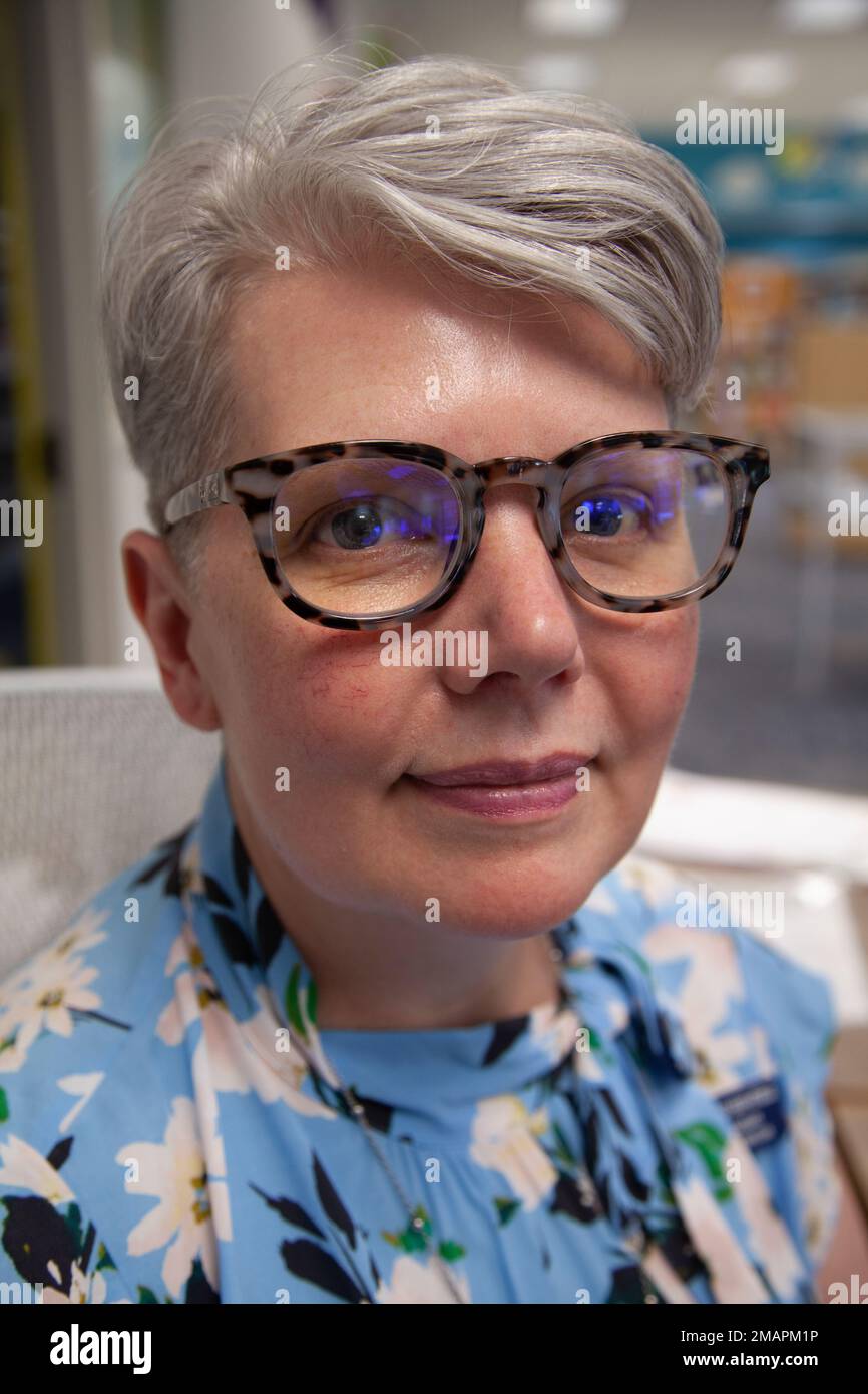 Holly Keene-Steele, a library technician, poses for a portrait for a ...