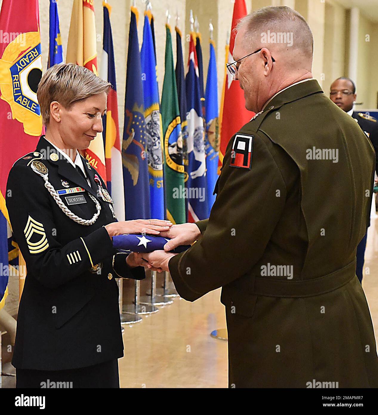 Maj. Gen. Jeffrey Jurasek, deputy commanding general for support, First U.S. Army, presents ...