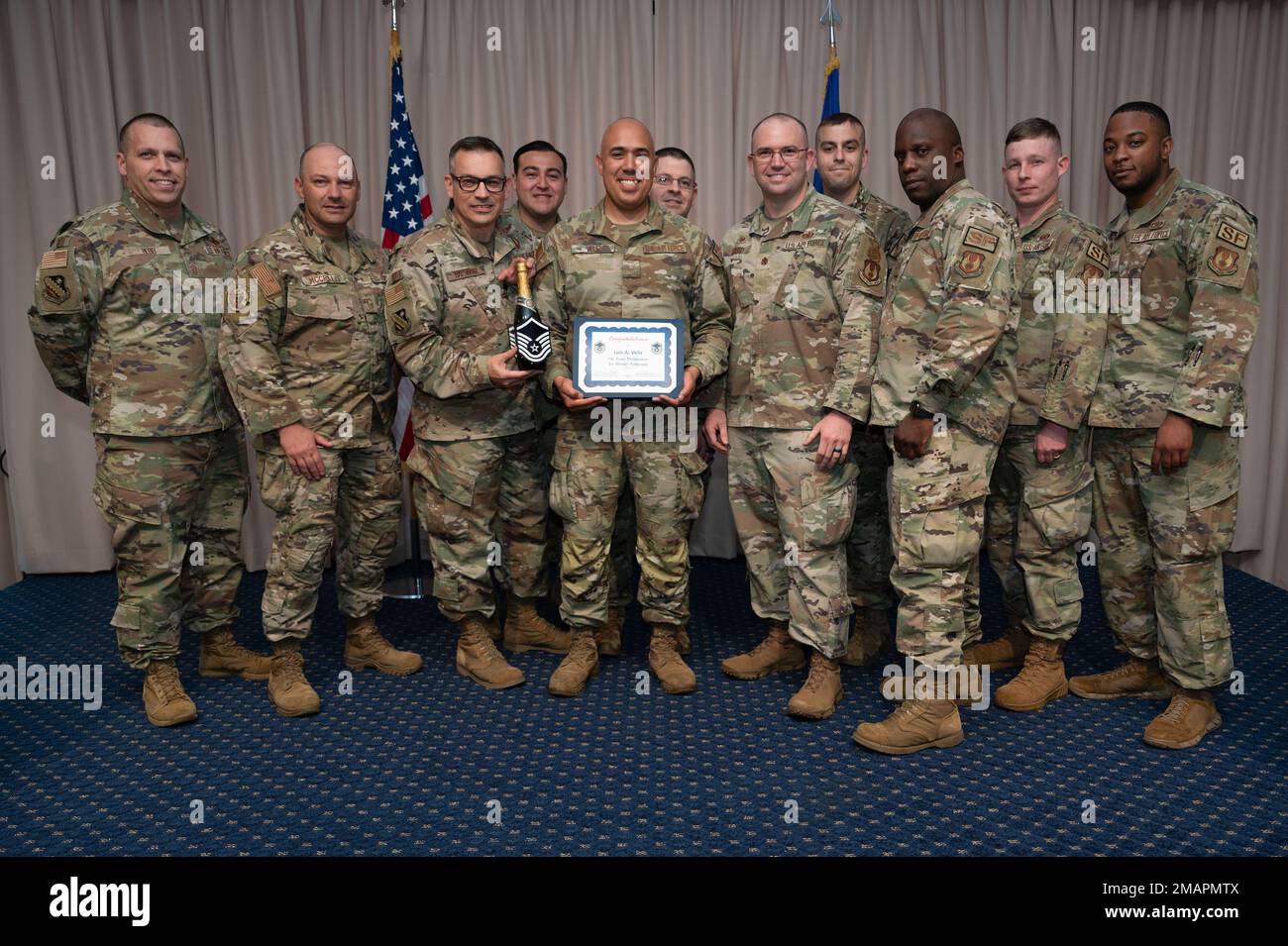 Tech. Sgt. Louis Veliz, center, 66th Security Forces Squadron physical ...