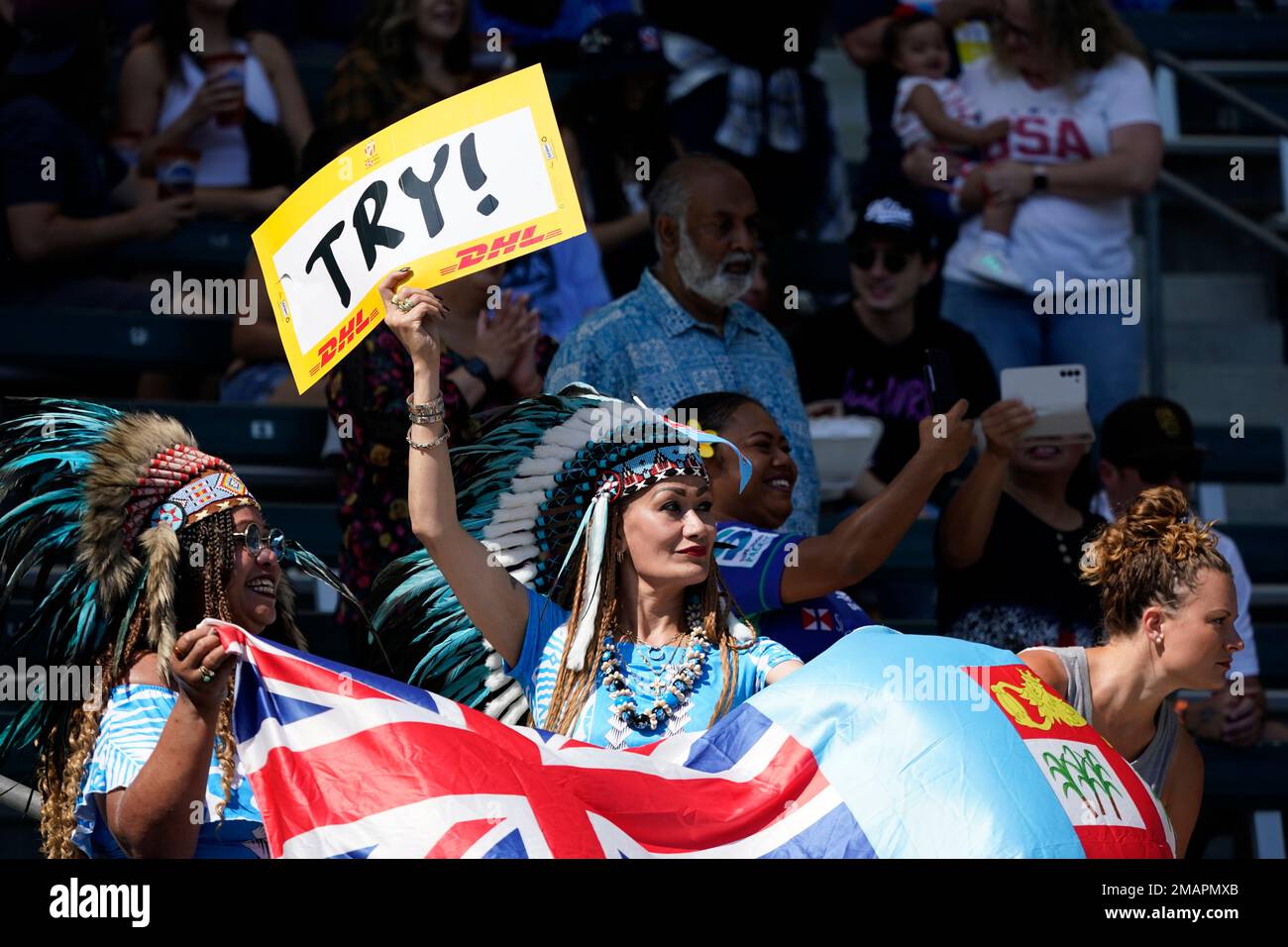 Fijian fans celebrate as their side scores a try against the United ...