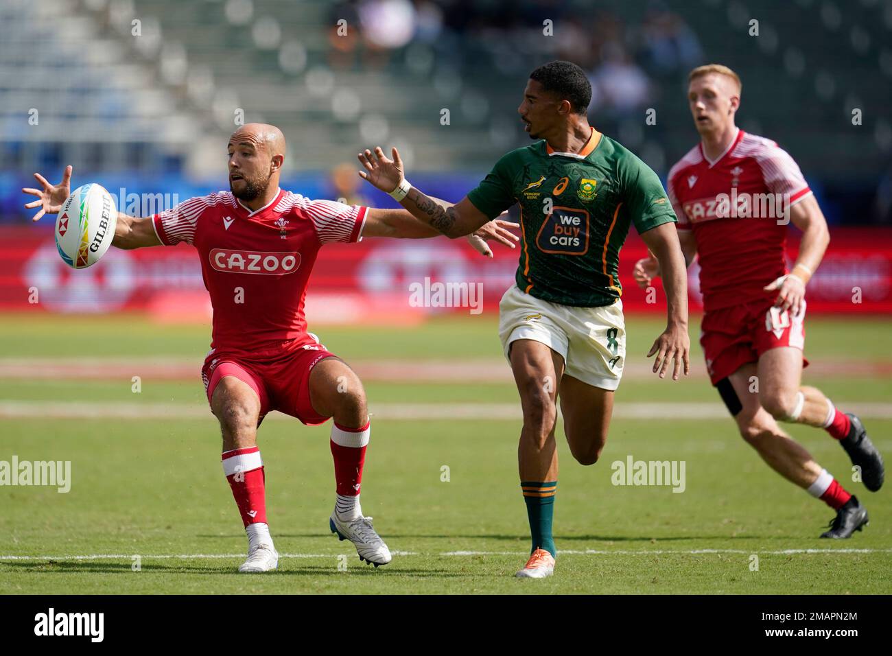 Wales's Luke Treharne, left goes to catch a loose ball as South Africa ...
