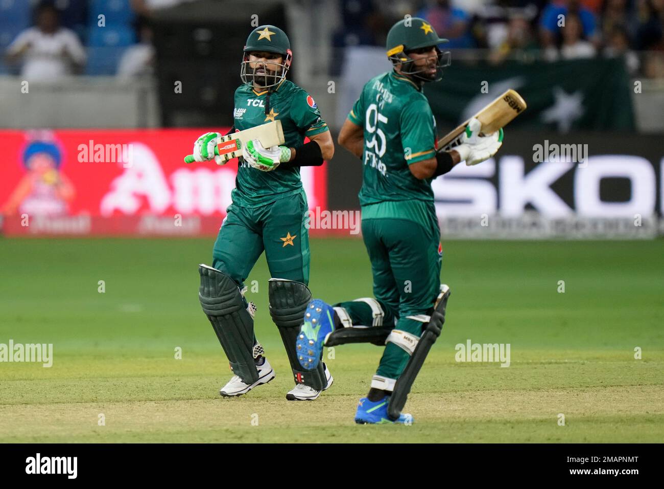 Pakistan's Mohammad Rizwan, left, and Iftikhar Ahmed run between the ...