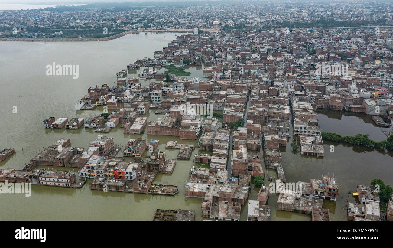 Flood waters surround houses on the banks of the river Ganges following ...