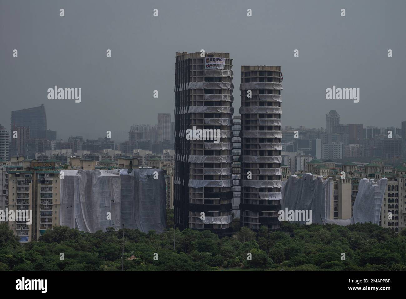 Twin high-rise apartment towers are seen before they are leveled to the ...