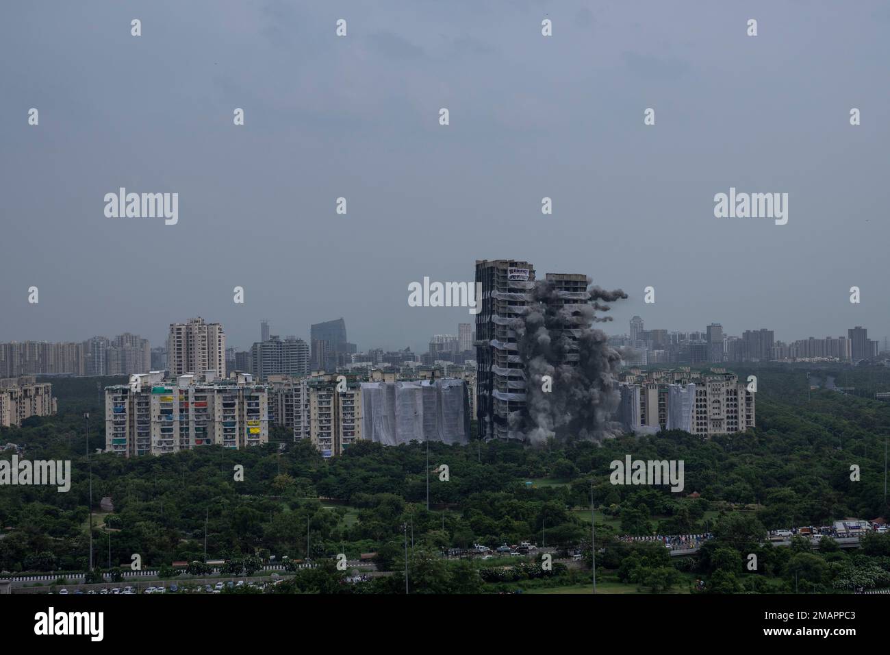 Explosives are detonated to demolish twin high-rise apartment towers in ...