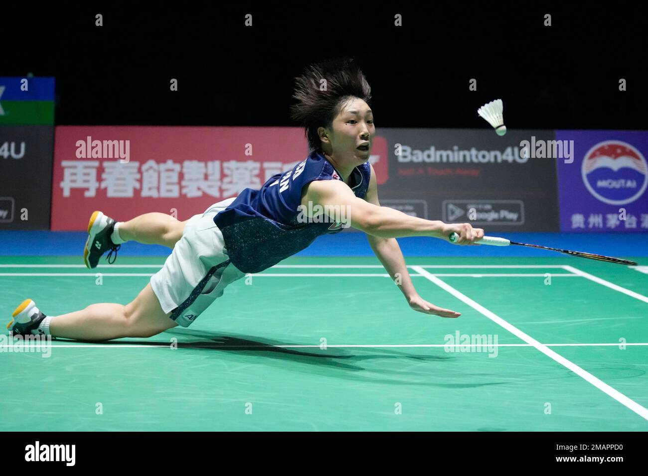 Japan's Akane Yamaguchi dives to return a shot to China's Chen Yu Fei ...