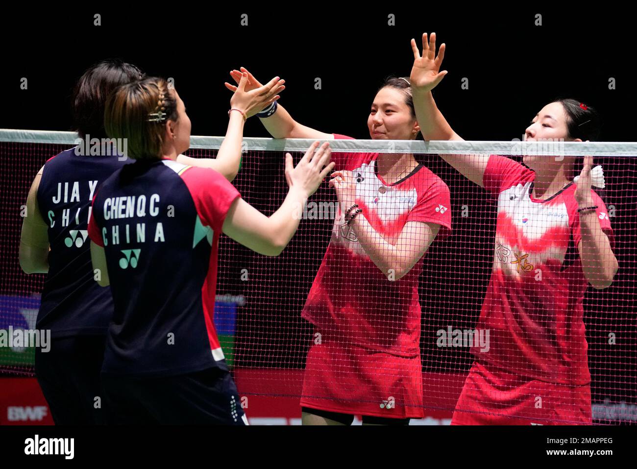 Chen Qing Chen, second left, and Jia Yi Fan, left, of China shake hands with South Korea's Kim ...