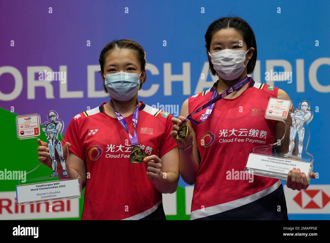 Chen Qing Chen, left, and Jia Yi Fan of China celebrate with their gold medals on the podium ...