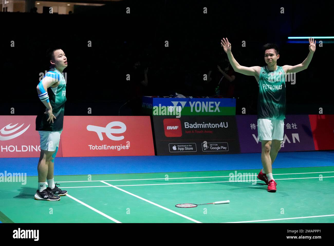 Malaysia's Aaron Chia, left, and Soh Wooi Yik celebrate after defeating Indonesia's Mohammad ...