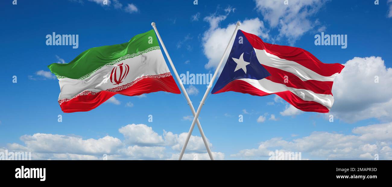 two crossed flags Puerto Rico and Iran waving in wind at cloudy sky. Concept of relationship ...