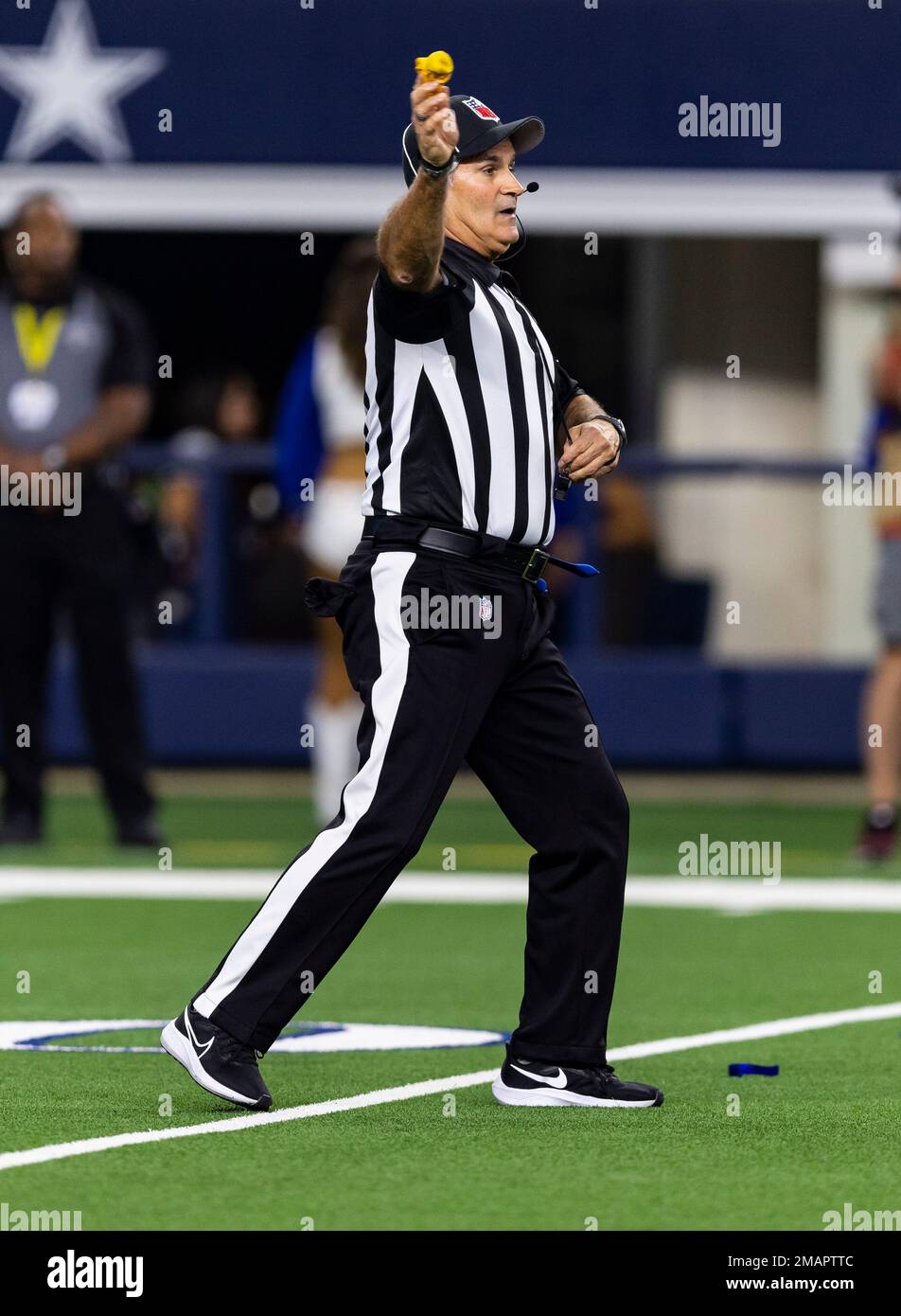 Umpire Carl Paganelli (124) throws a penalty flag during a preseason ...