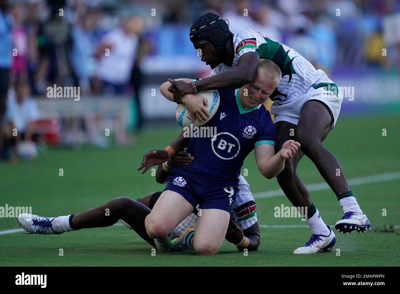 Scotland's Reiss Cullen is brought down by Kenya's Vincent Onyala ...