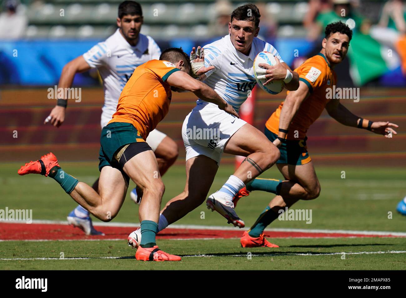 Australia's Josh Turner, left tackles Argentina's Luciano Gonzalez ...