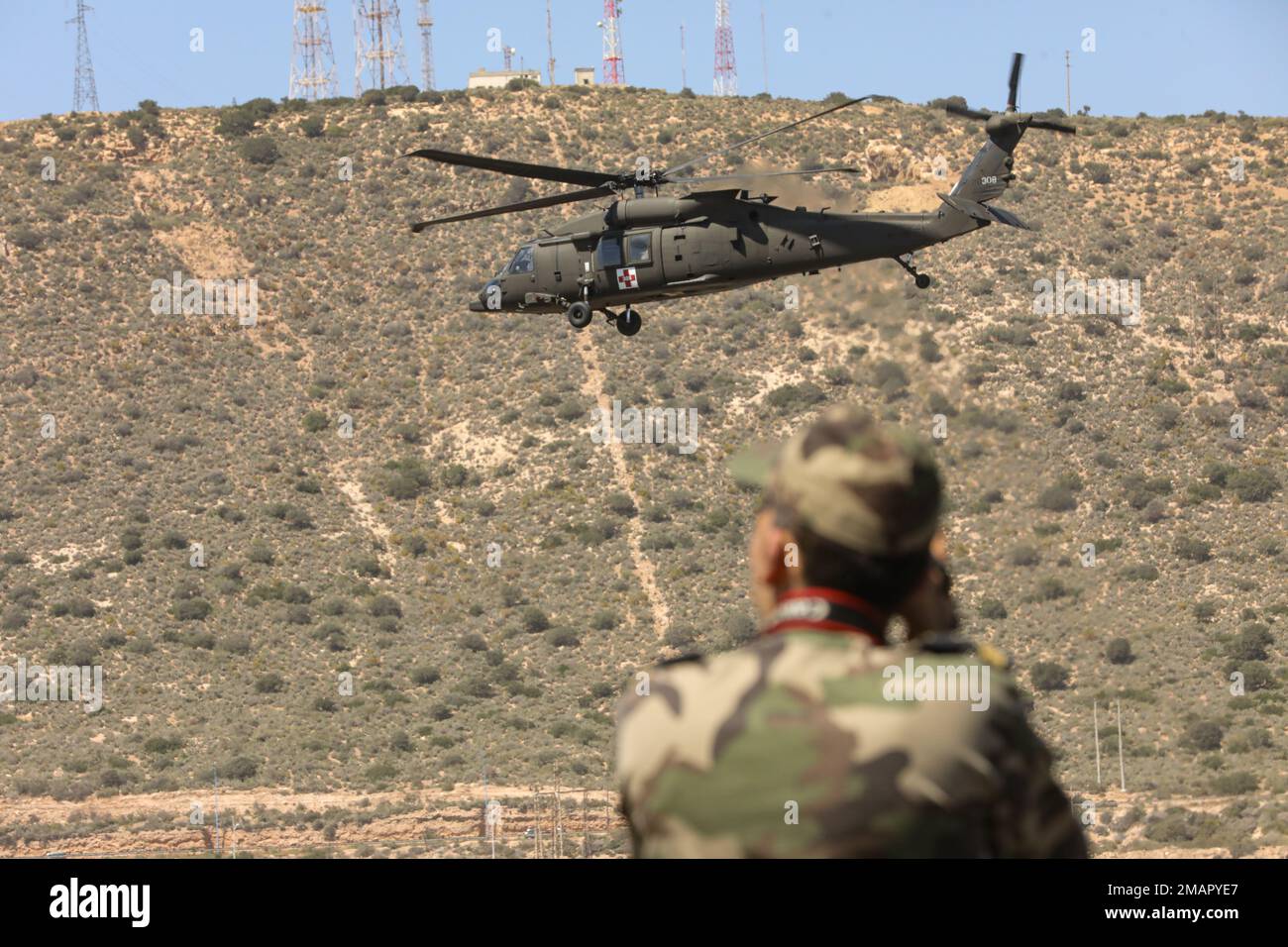 A Moroccan soldier captures images of a U.S. Army Blackhawk Helicopter ...
