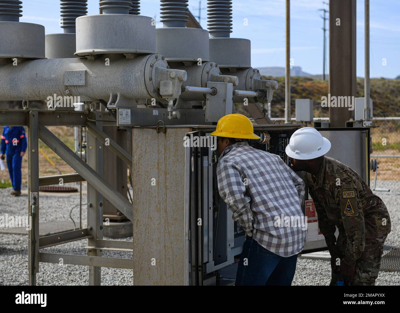 Mr. Volkmer Garcia, left, electrical engineering technician, and Staff ...
