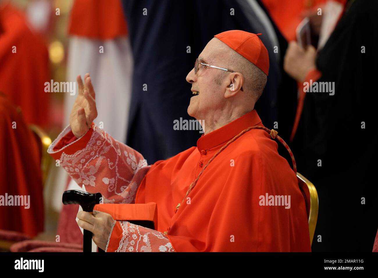Cardinal Tarcisio Bertone waves as he attends the consistory inside St ...