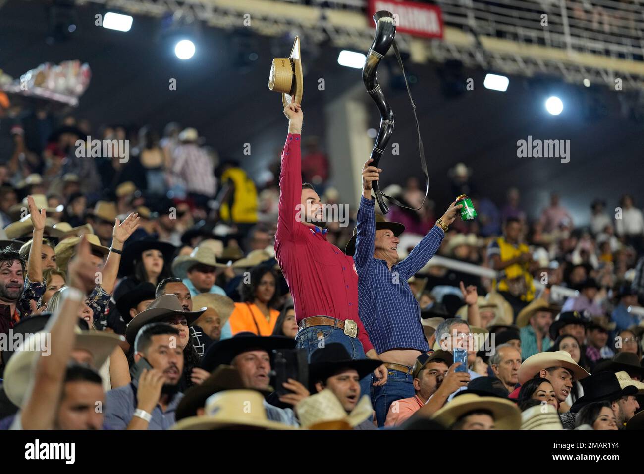 Fans cheer during horse riding competition at the Barretos Rodeo ...