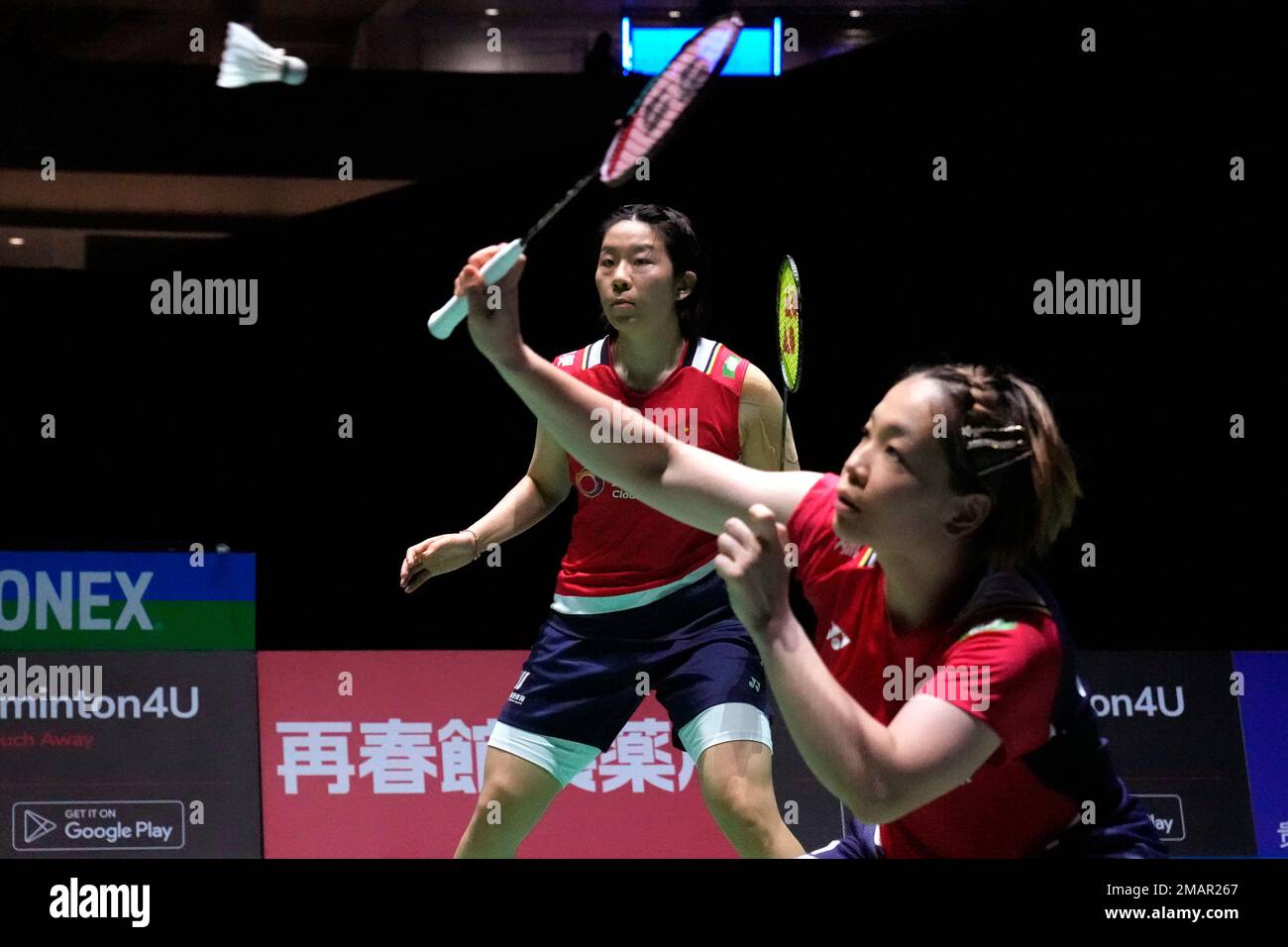 China's Chen Qing Chen, right, and Jia Yi Fan compete during a badminton game of the the women's ...