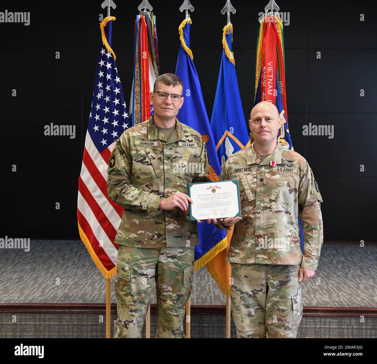 Col. Michael S. Johnson, 110th Aviation Brigade commander, presents the ...