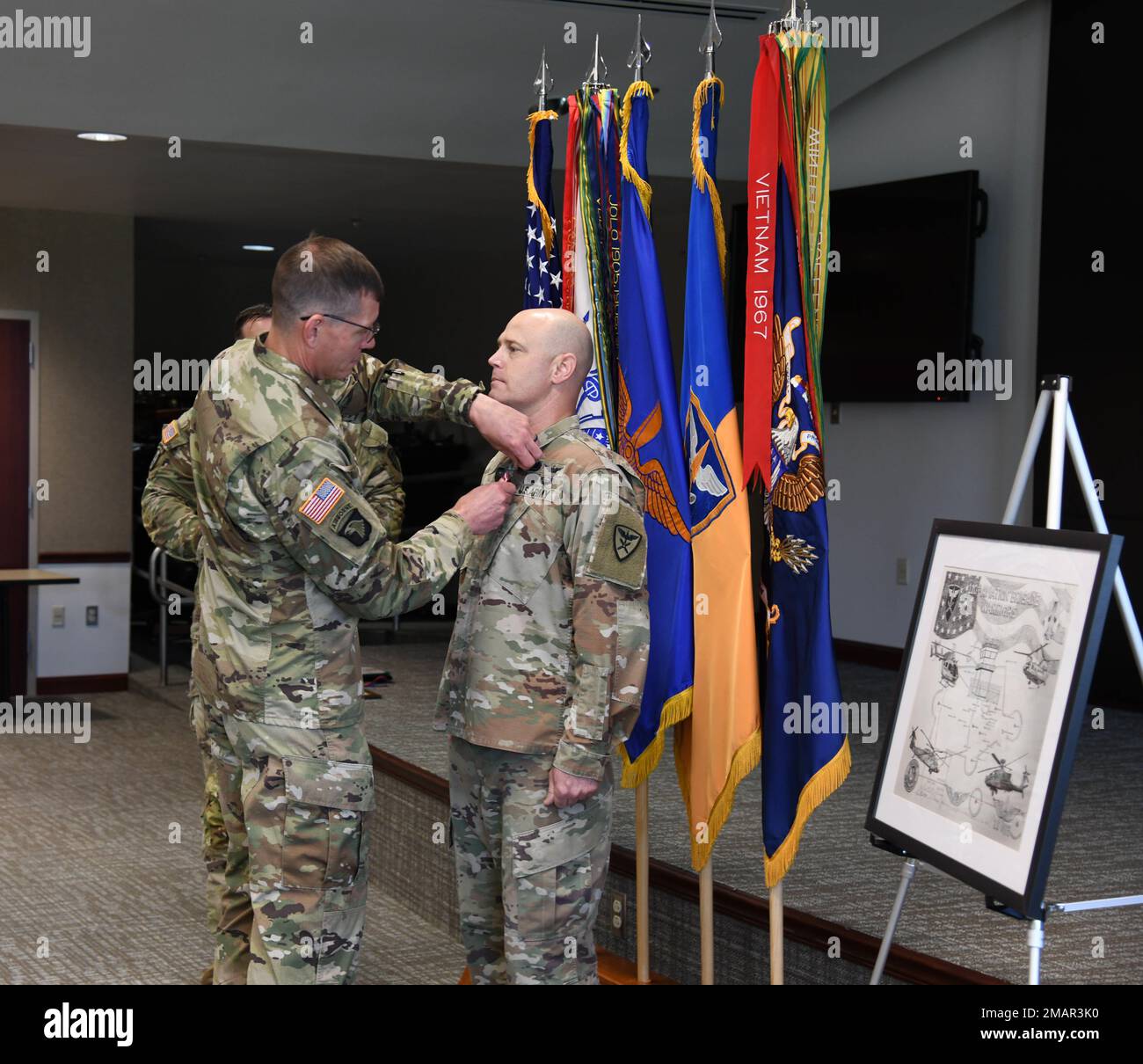 Col. Michael S. Johnson, 110th Aviation Brigade commander, presents the ...