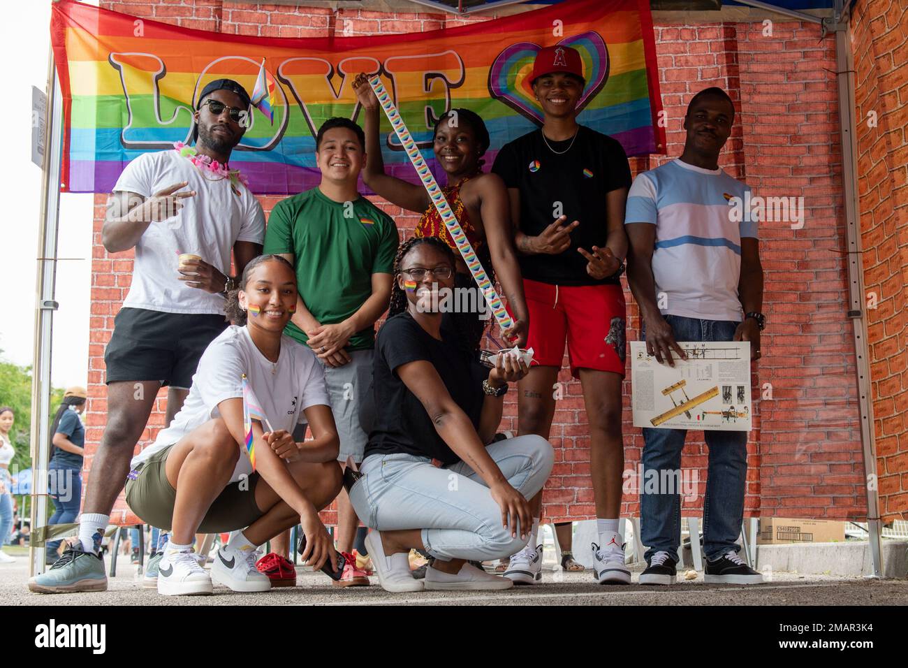 Attendees pose for a photo at the cultural fair held during Diversity ...