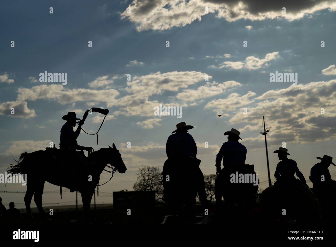 Mounted horseman are silhouetted against the sky as they arrive to ...