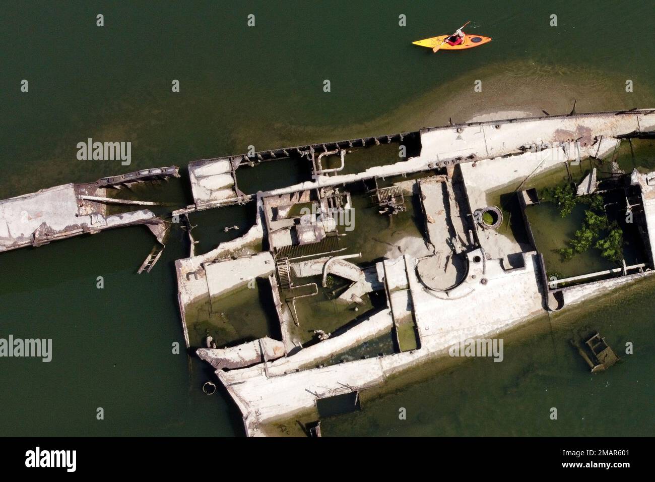 Kayaker Aleksandar Bzdusok paddles by the wreckage of a WWII German ...