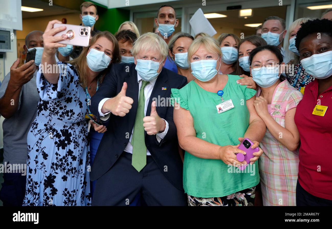 Britain's Prime Minister Boris Johnson poses for a photograph with ...
