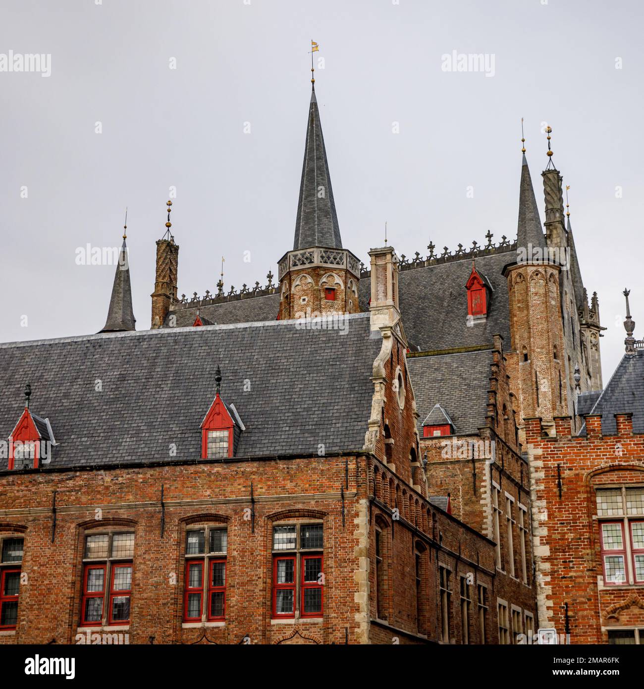Gothic architecture in Flanders. Palace spiers in Bruges, Belgium Stock ...
