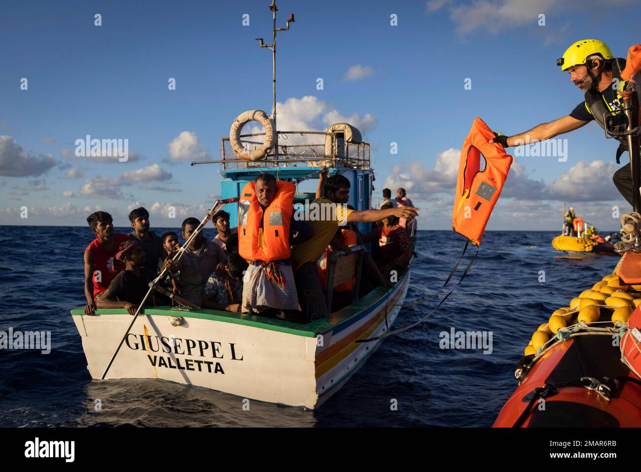 A crew member of the NGOs SOS Mediterranee and the International ...