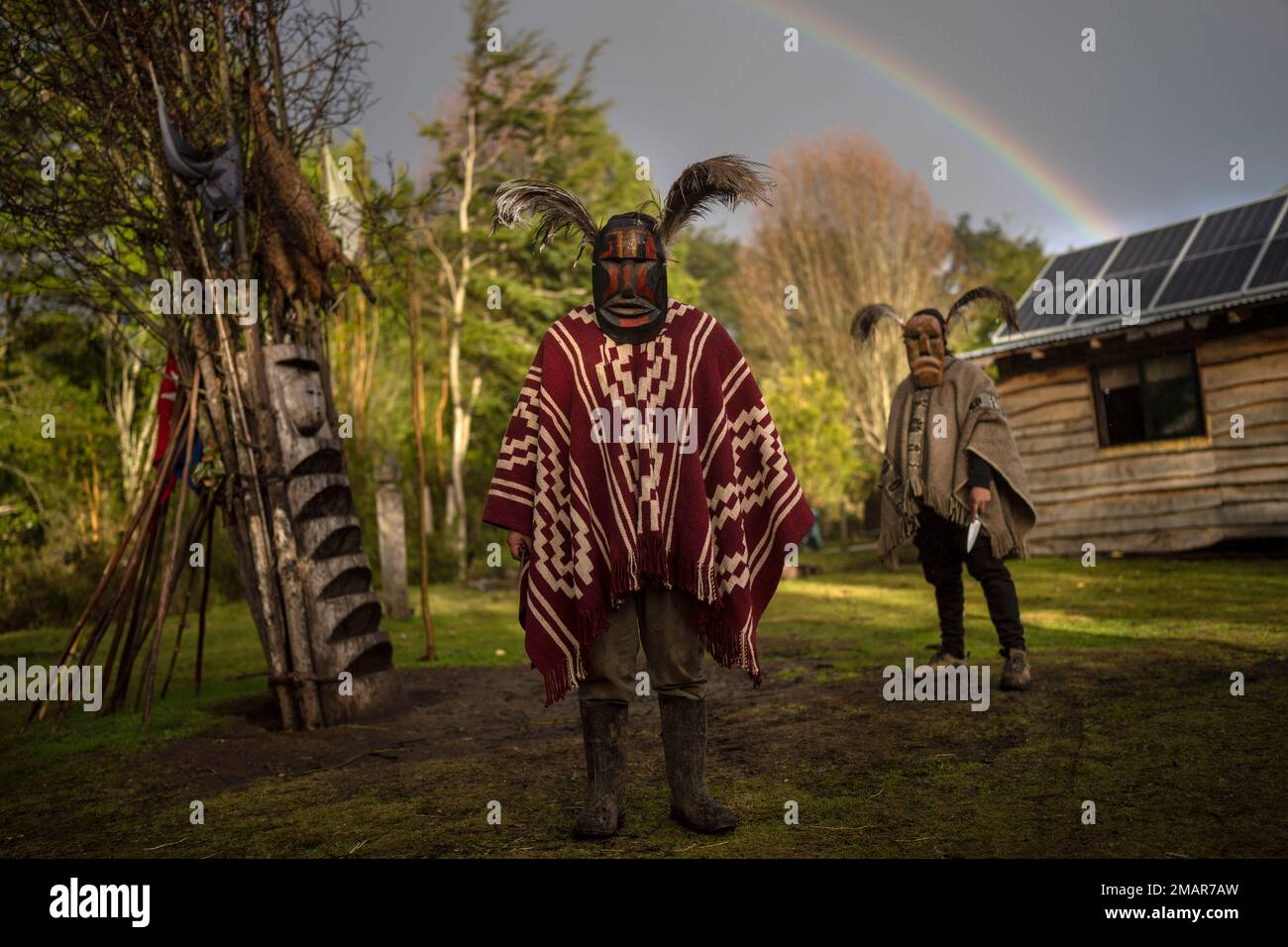 Mapuche men pose for a photo wearing kollon, or ceremonial masks ...