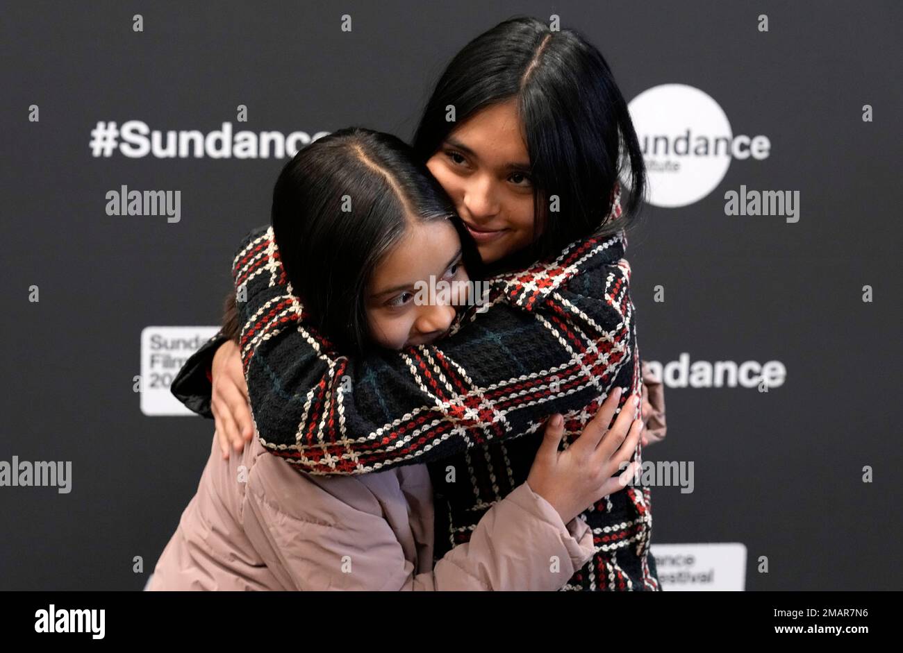 Mia Fernanda Solis, left, and Jennifer Trejo, cast members in "Radical," embrace at the premiere ...