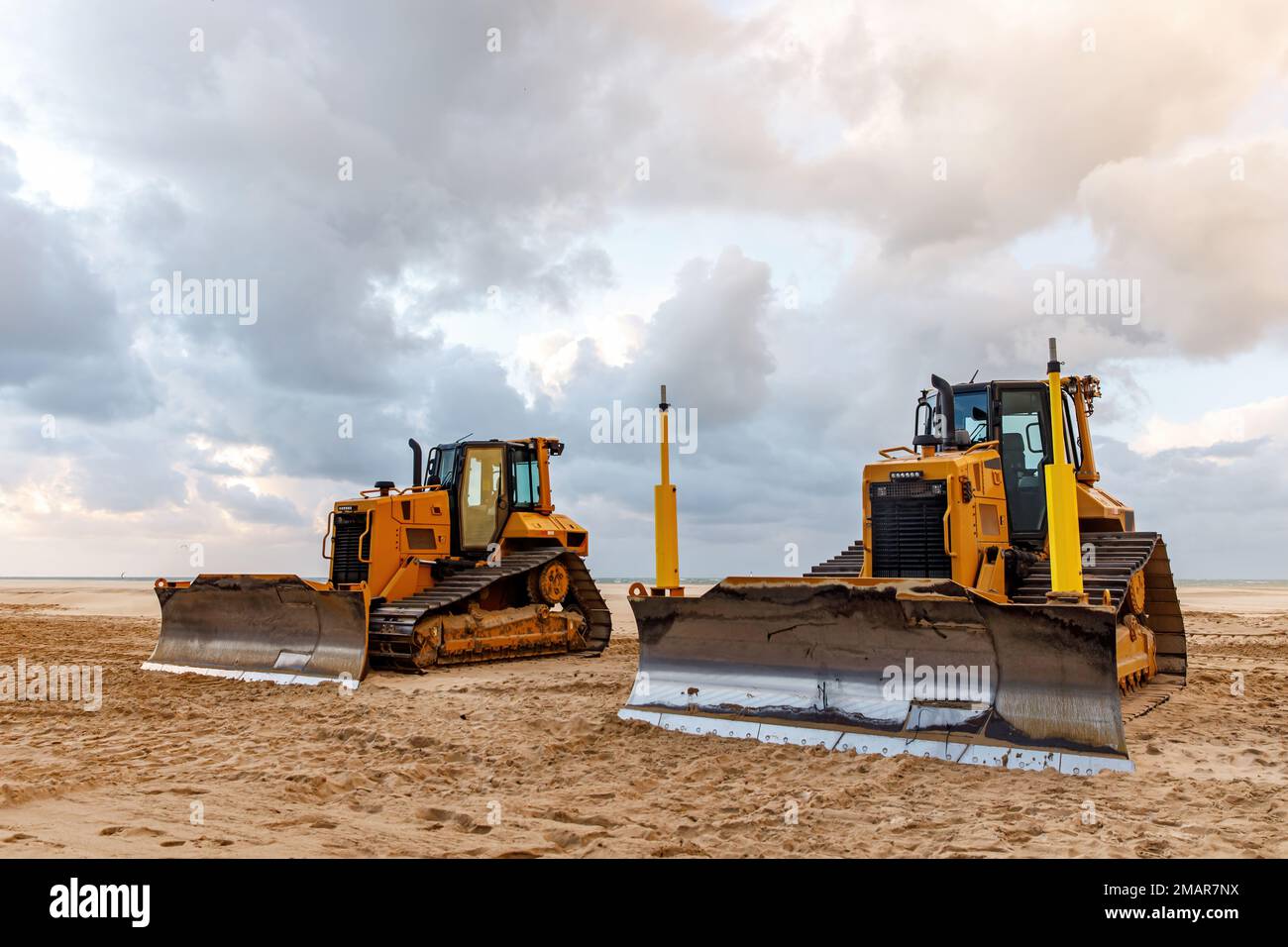 Bulldozer prepares the sea beach for the season Stock Photo - Alamy