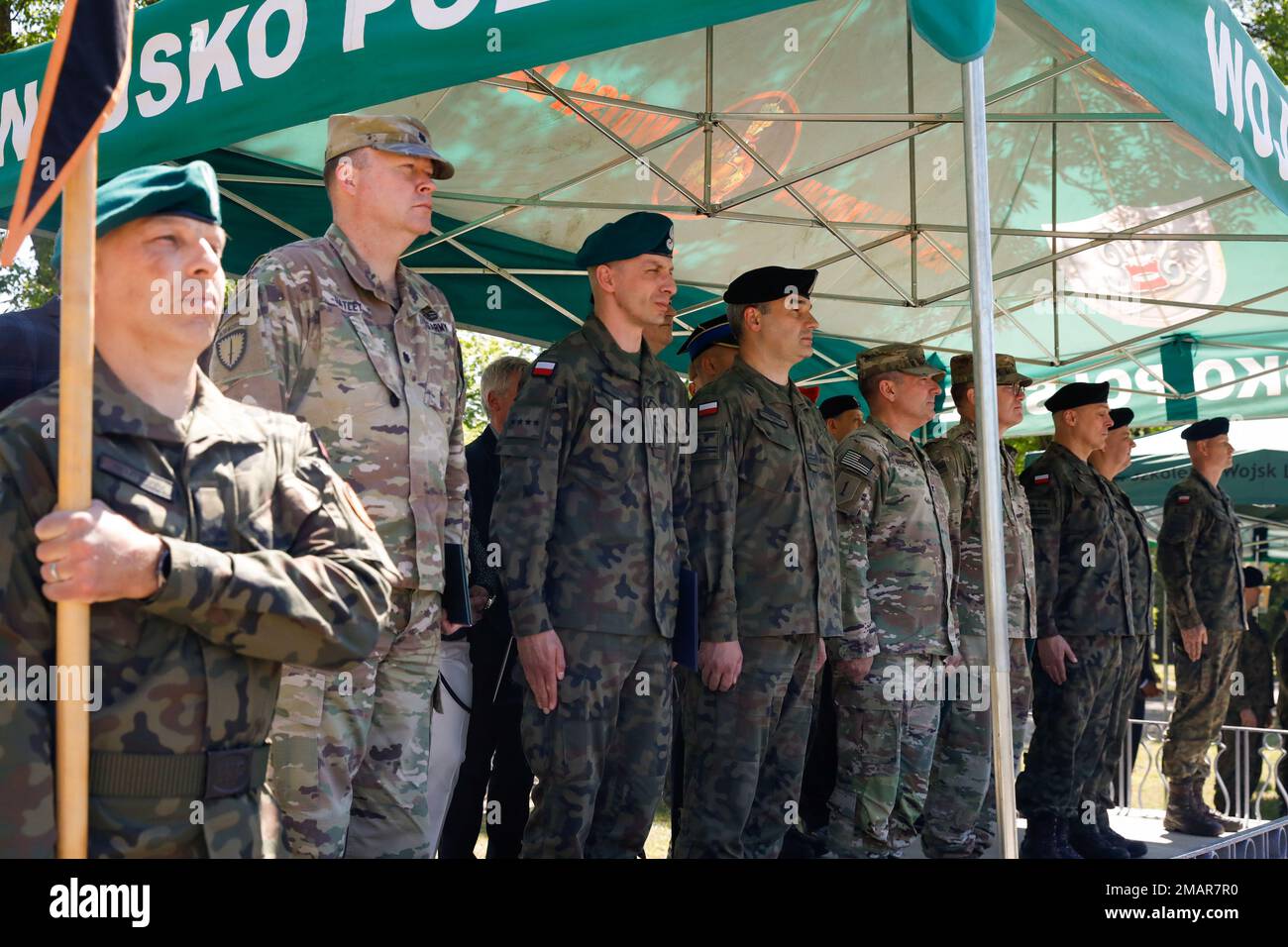 Polish and U.S. Soldiers stand at attention during a ceremony at ...