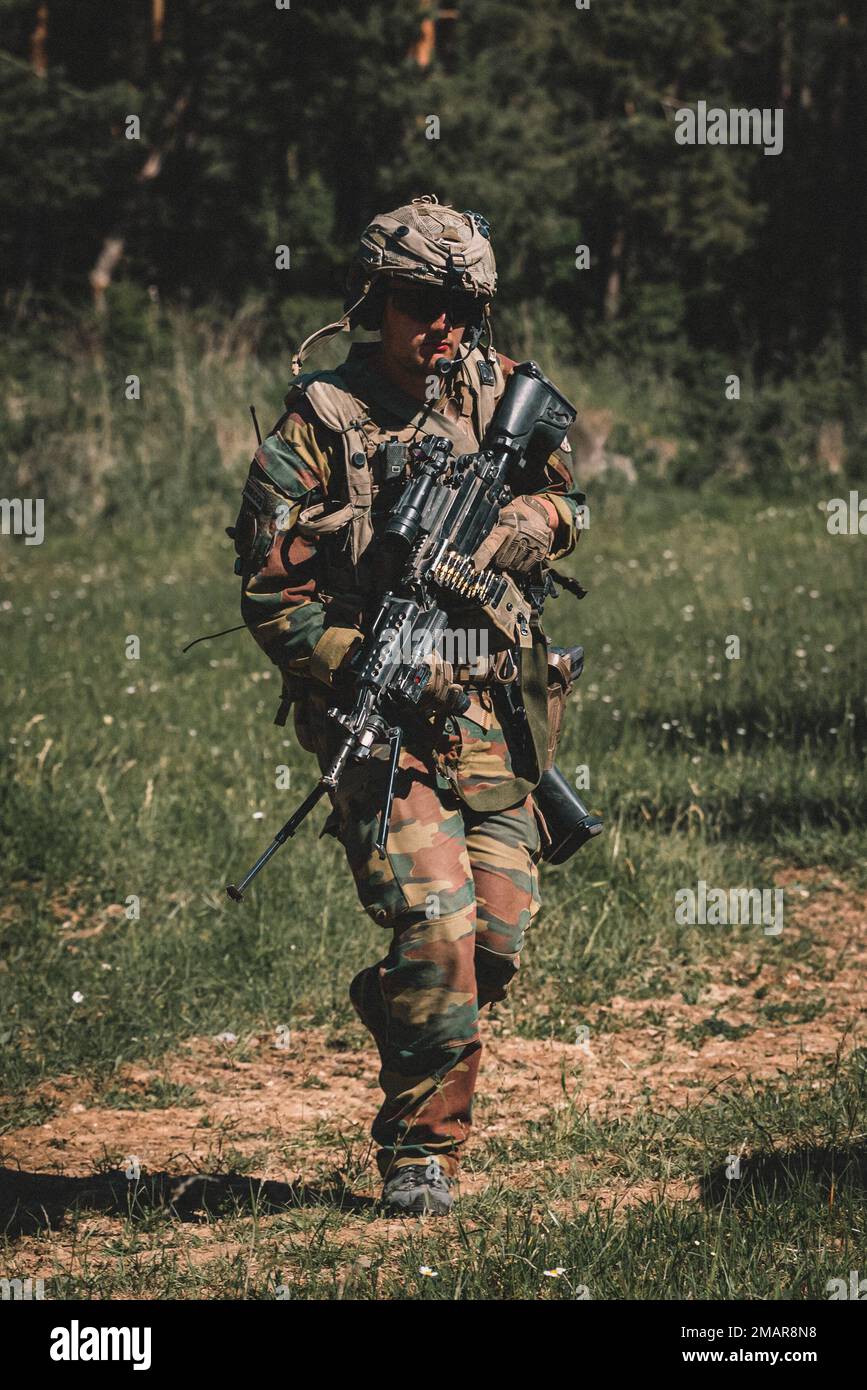 A Belgian Armed Forces soldier assigned to ISTAR COY reacts to contact ...