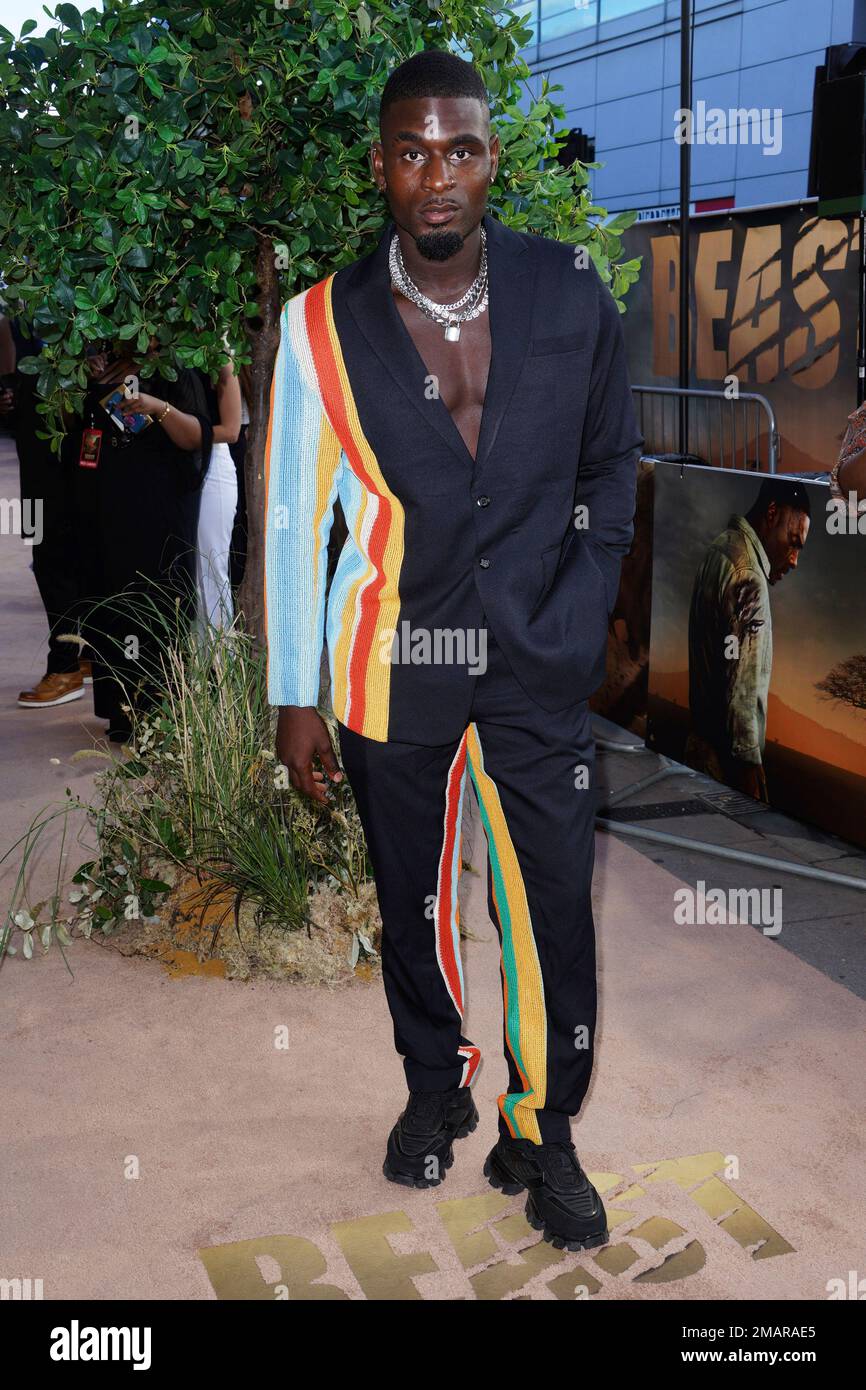 Dami Hope poses for photographers upon arrival at the UK special ...