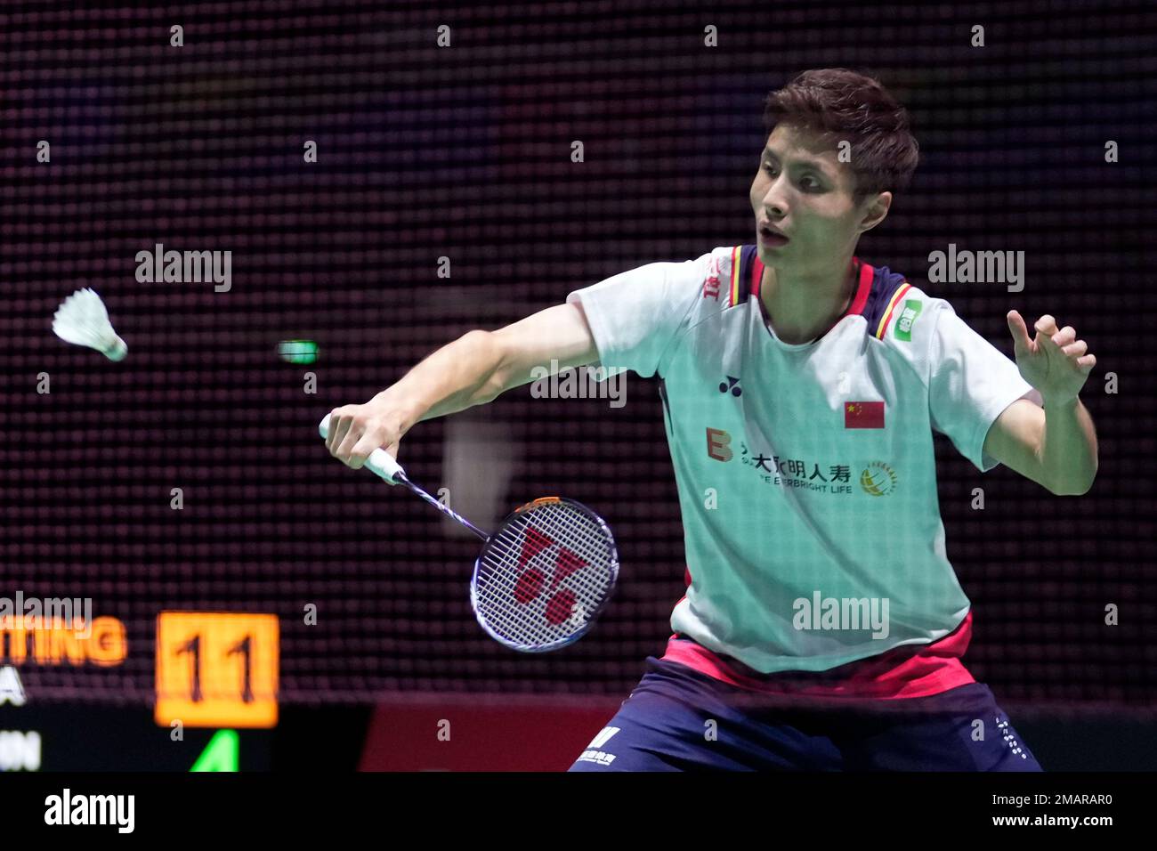 Shi Yu Qi of China plays a return during a badminton game of the men's ...