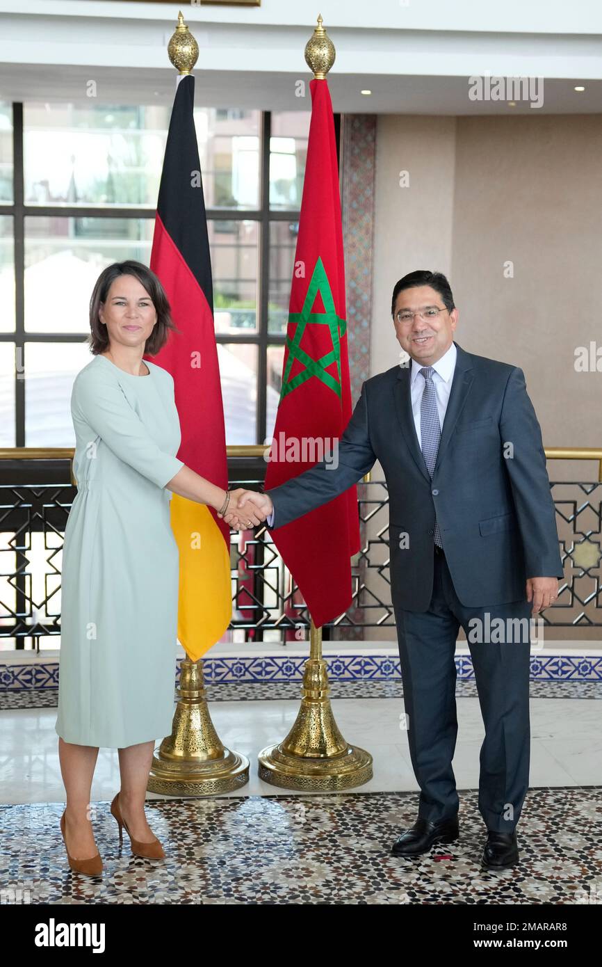 German Foreign Minister Annalena Baerbock, left, shakes hands with ...