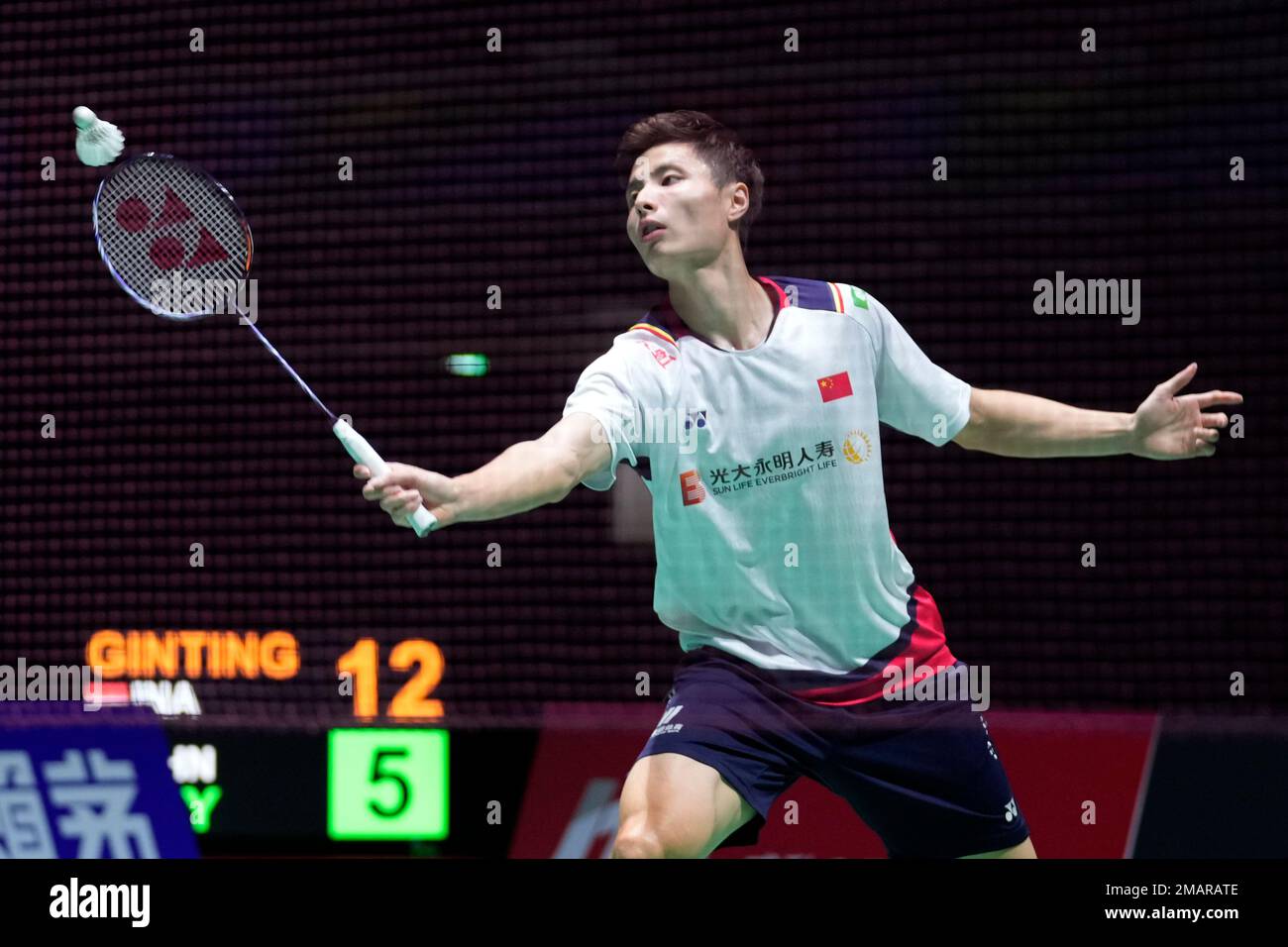 Shi Yu Qi of China plays a return during a badminton game of the men's ...
