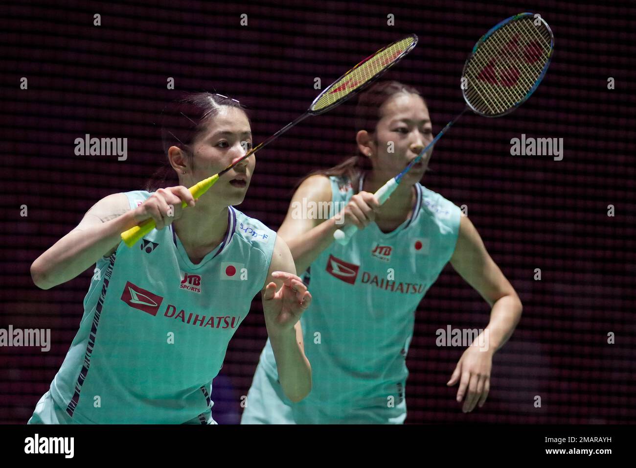 Chiharu Shida, left, and Nami Matsuyama of Japan, compete in a badminton game of the women's ...