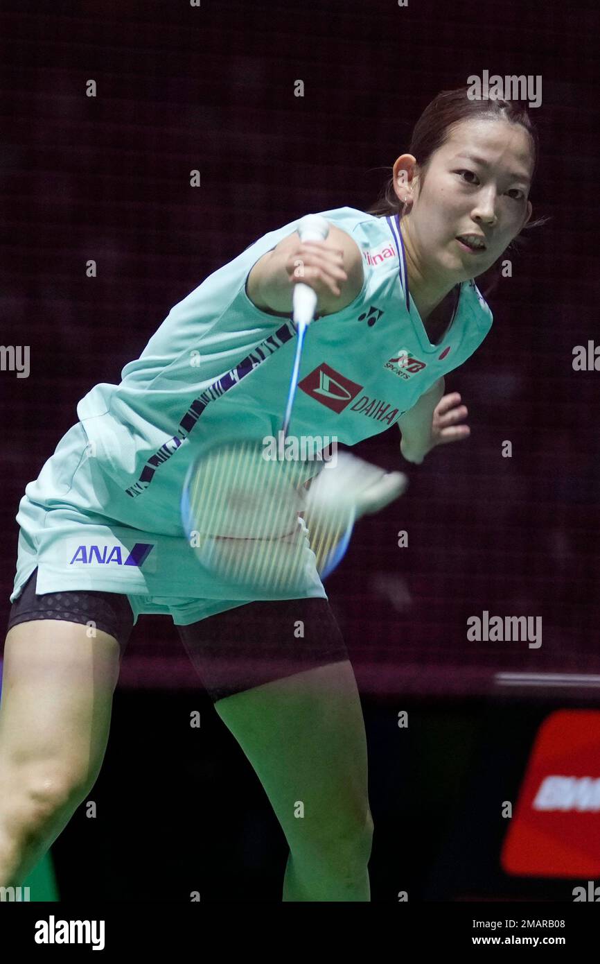 Nami Matsuyama of Japan, with Chiharu Shida of Japan, plays a return during a badminton game of ...