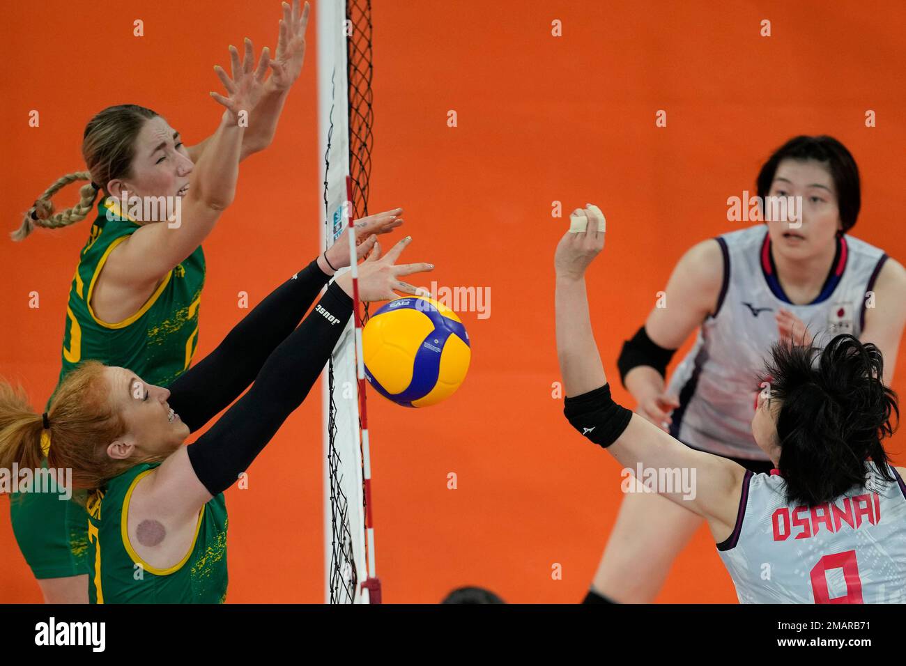 Japan's Miwako Osanai, hits the ball during their preliminary match against Australia at Asian ...